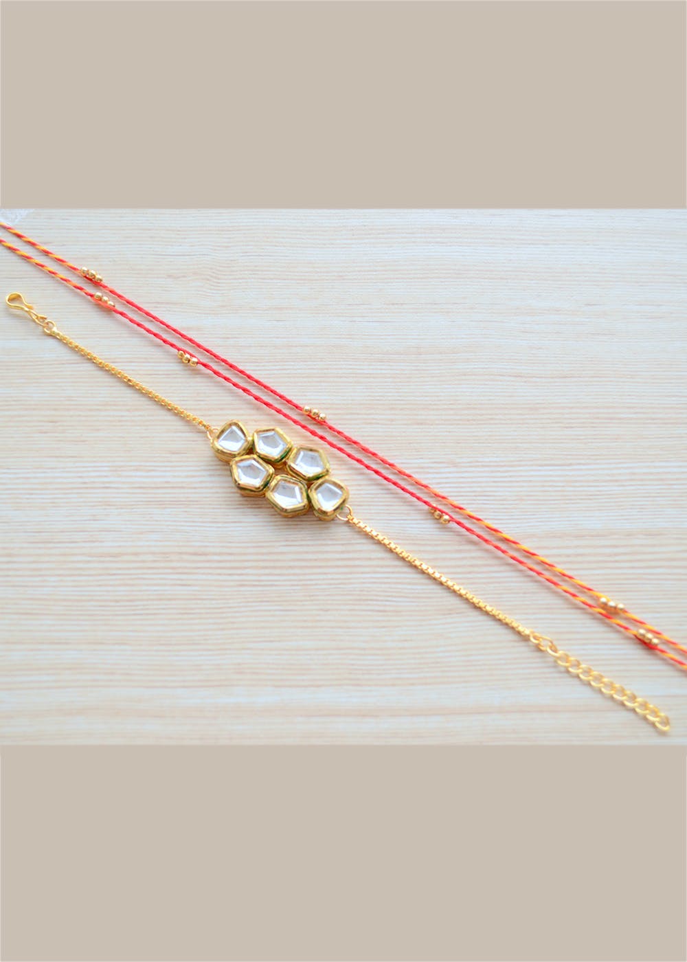 Get Sacred Mauli Thread Rakhi with Cluster Faux Polki Bracelet Gift Set ...