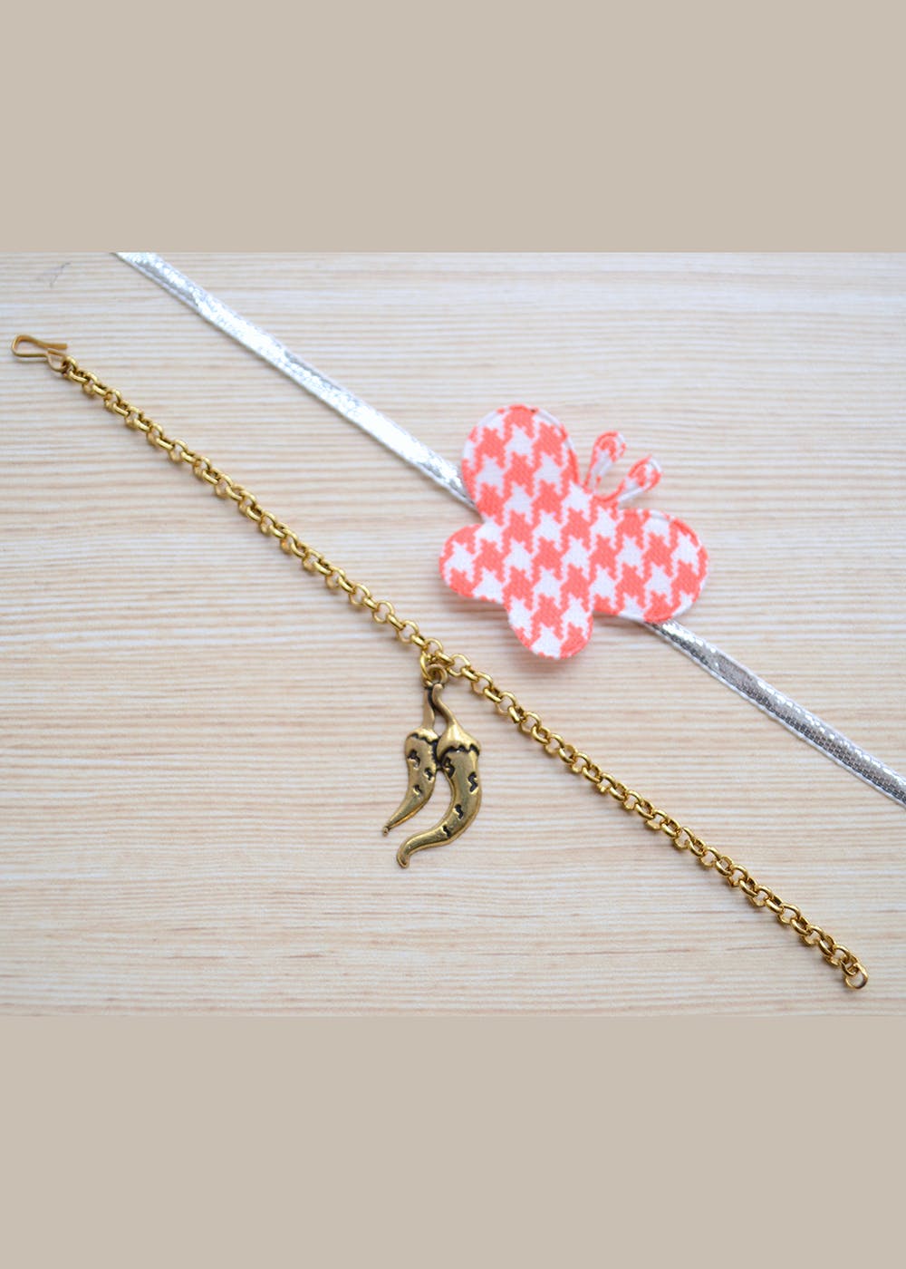 Get Hounds Tooth Butterfly Rakhi with Twin Chilly Metal Bracelet at ...