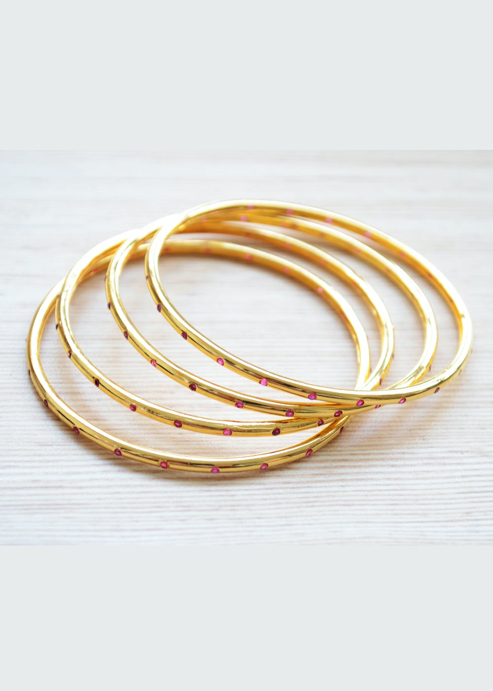 Get Stackable Gold Ruby Minimalist Bangles - Set of 4 at ₹ 1599 | LBB Shop