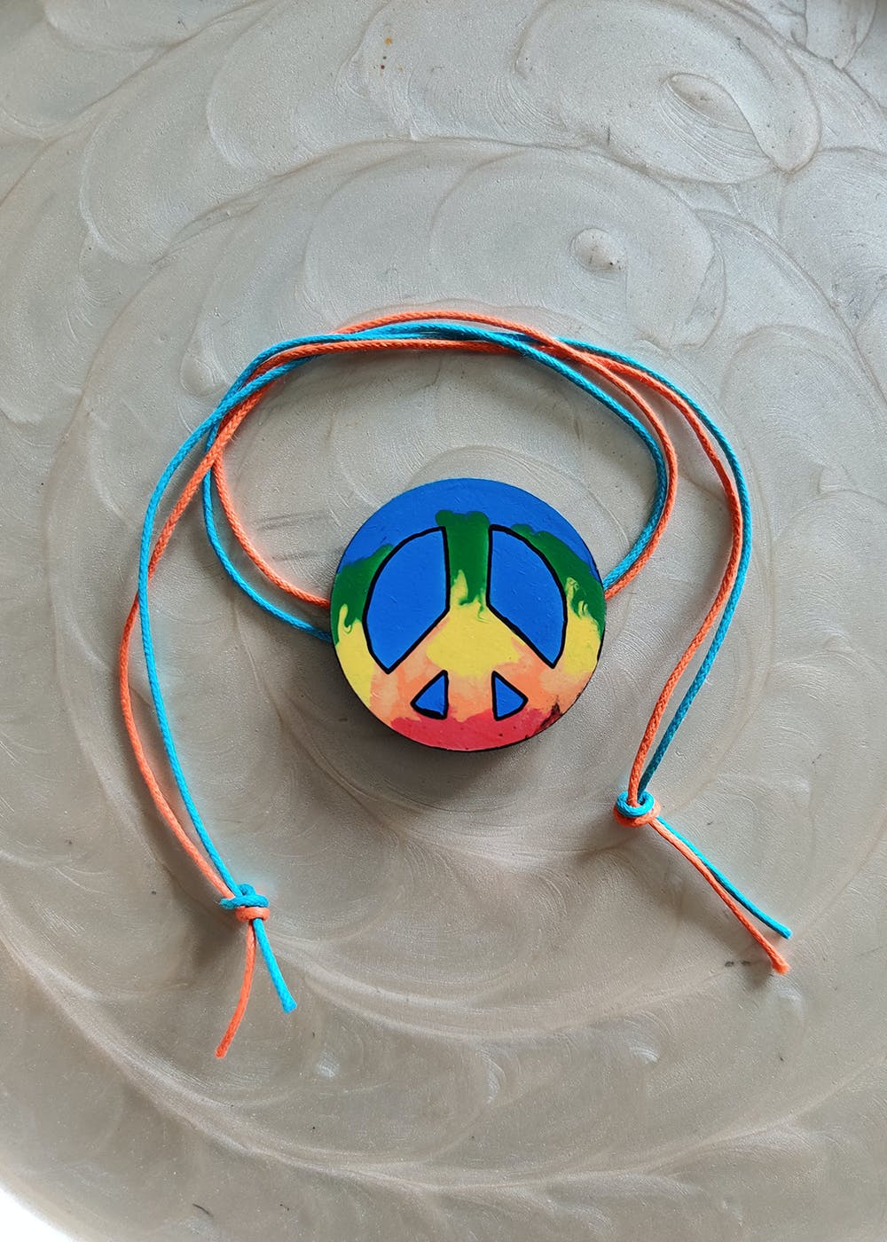 Get Blue Wooden Hand Painted Peace Brother Rakhi / Badge at ₹ 375 | LBB ...