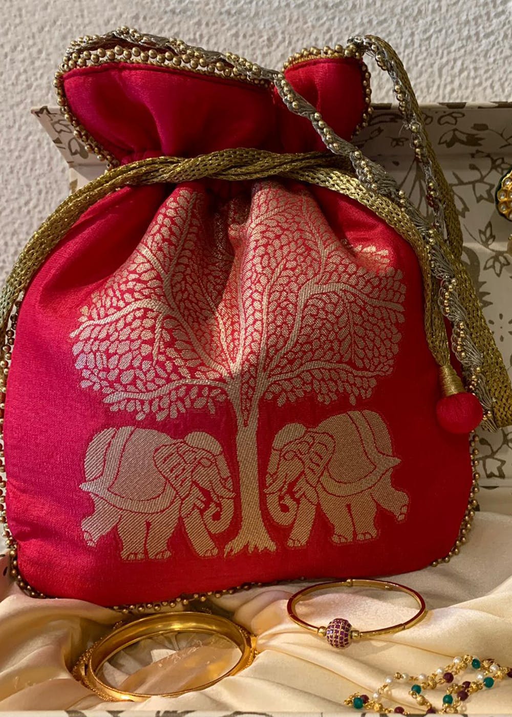 Get Ellie & Tree Printed Red Potli at ₹ 1950 | LBB Shop