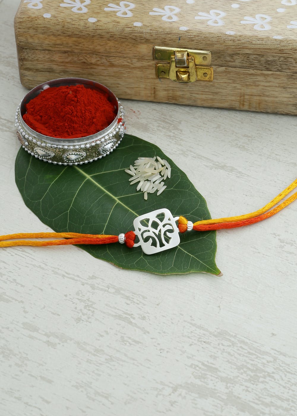 Get Cut Out Square Silver Plated Rakhi at ₹ 410 | LBB Shop