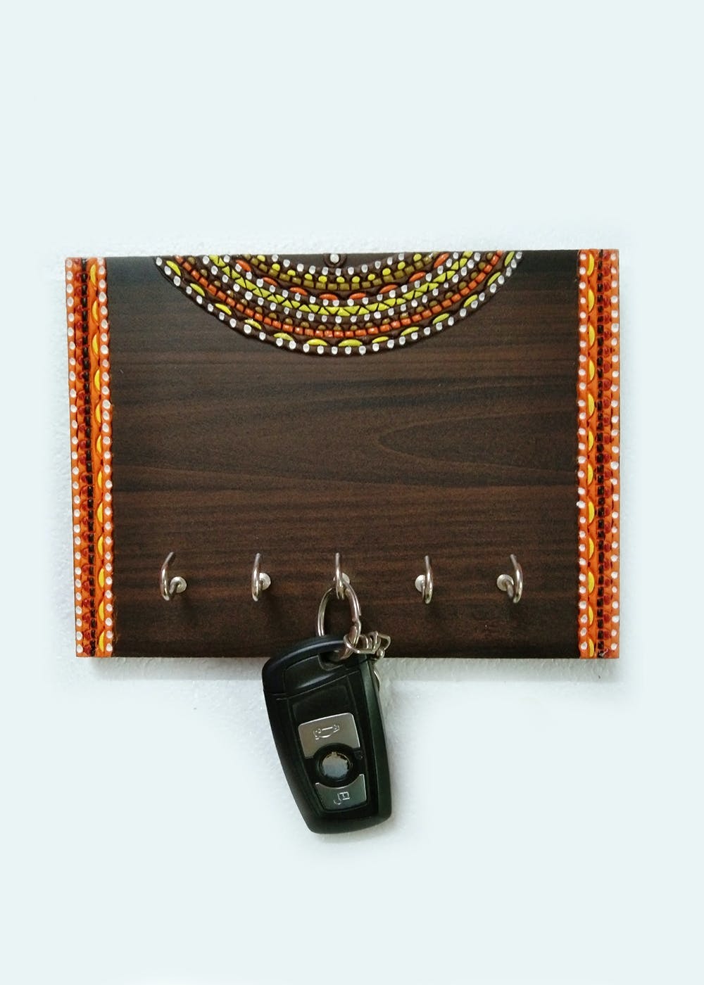 Get Orange Semi Circle & Vertical Border Detail Keyholder at ₹ 690 ...