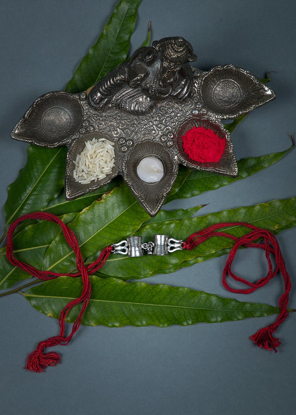 Get Silver Toned Trishul Damaru Red Rakhi at ₹ 365 | LBB Shop