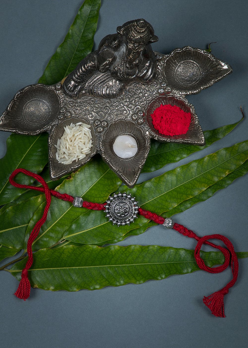 Get Silver Toned Chakra Red Rakhi at ₹ 315 | LBB Shop