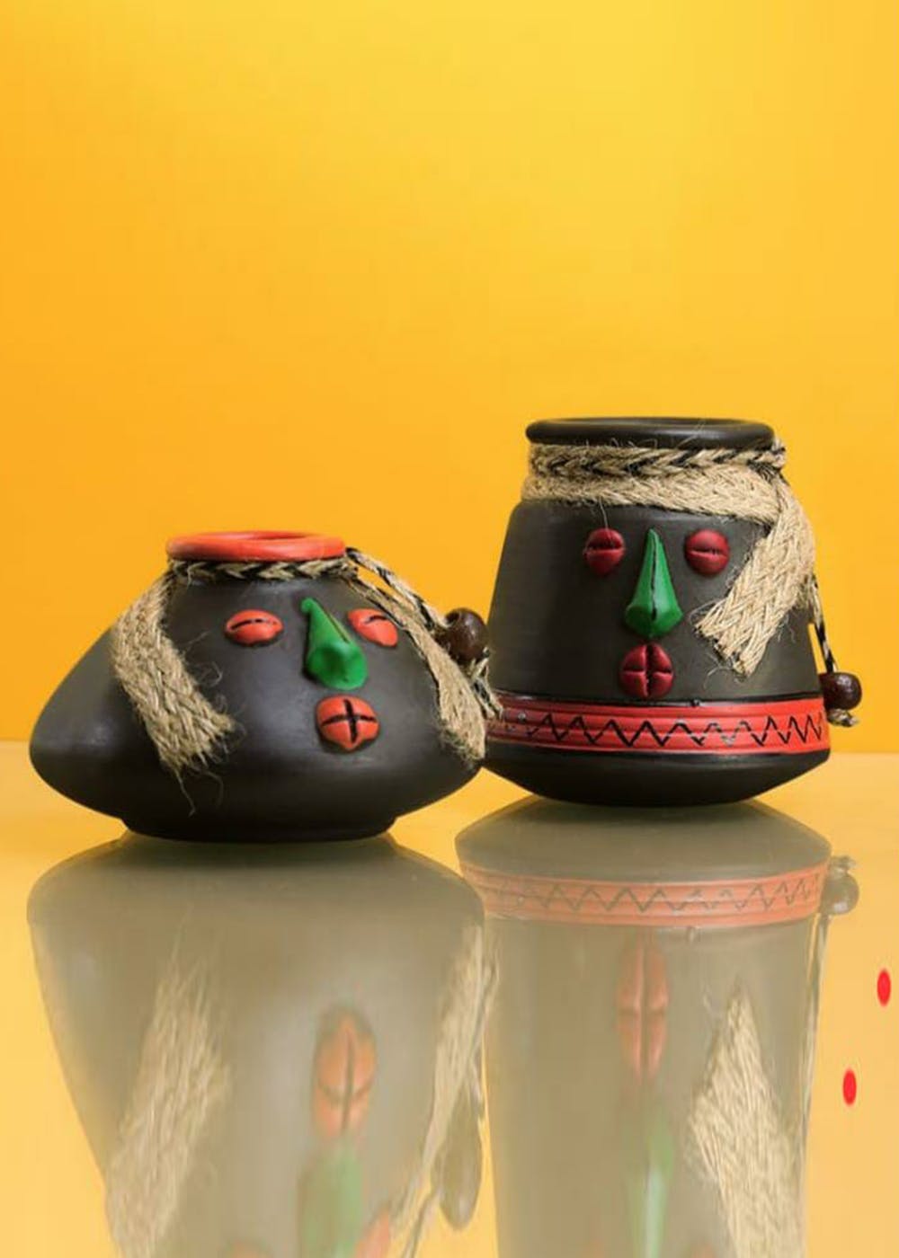 Get Set of 2 Tribal Faced Terracotta Pots at ₹ 1460 | LBB Shop