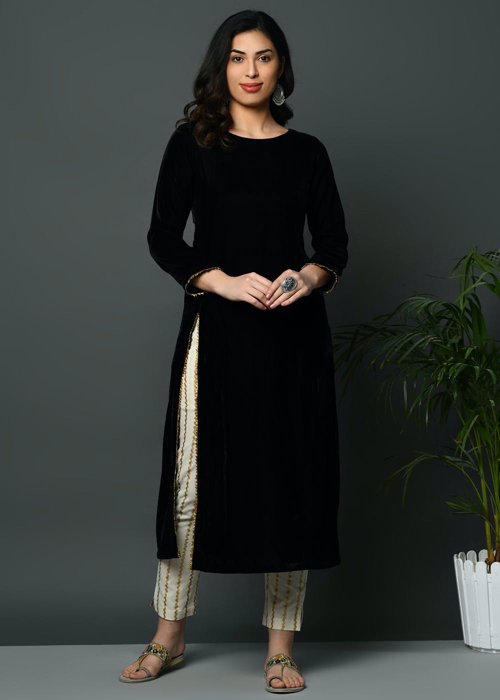 Get Side High Slits Detail Black Velvet Kurta With Gold Printed Pants ...