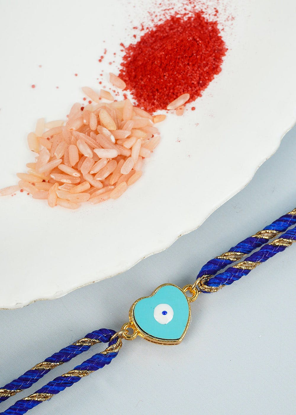 Get Evil Eye Heart Rakhi at ₹ 275 | LBB Shop